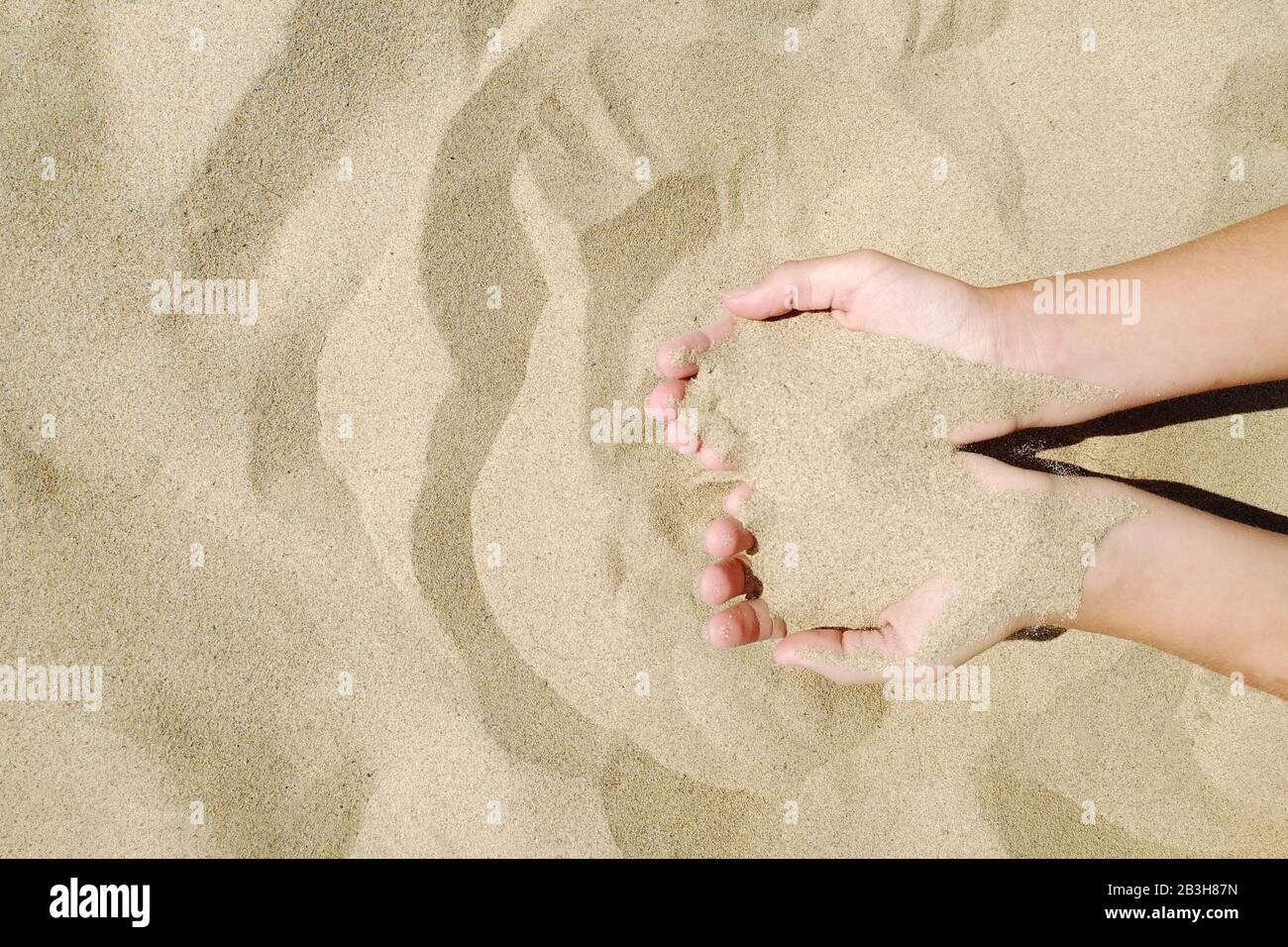Fingers through sand hi-res stock photography and images - Alamy