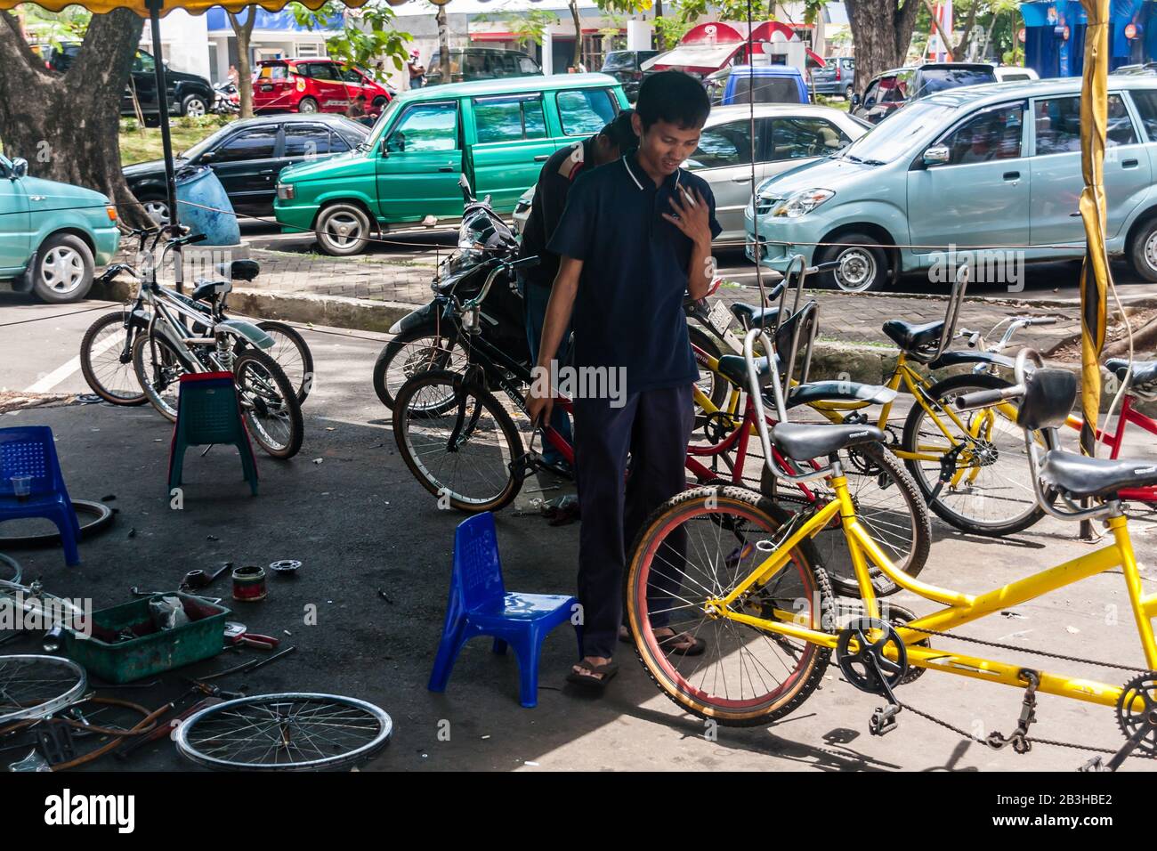 A street bicycle workshop on the street of Jakarta, Indonesia Stock ...