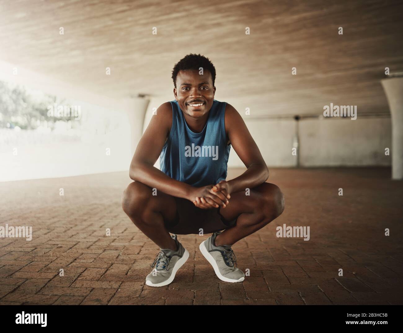 Crouching looking to camera hi-res stock photography and images - Alamy