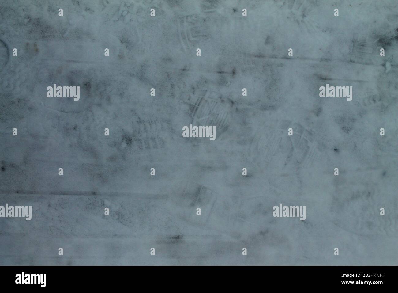 Surface covered with gray snow and ice. Winter background for design ...