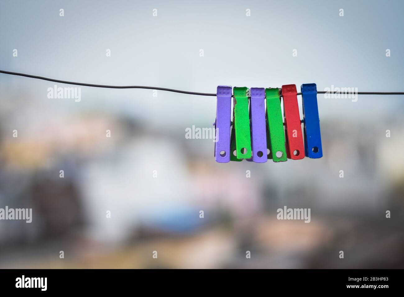 Yellow plastic clothes pegs hi-res stock photography and images - Alamy