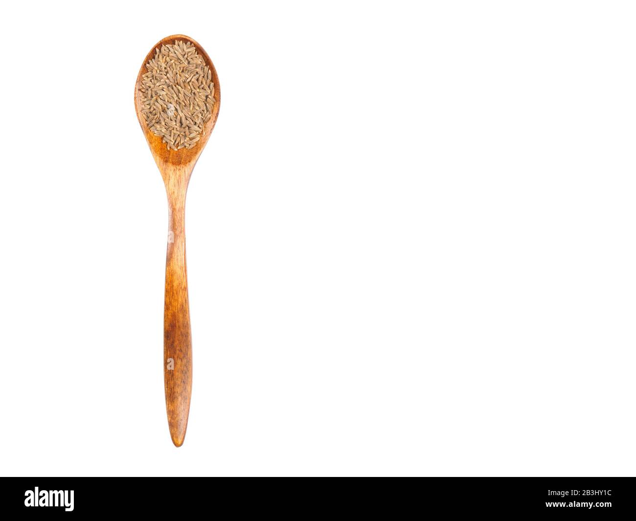 Spice cumin (jeera) in wooden spoon isolated on white Stock Photo - Alamy