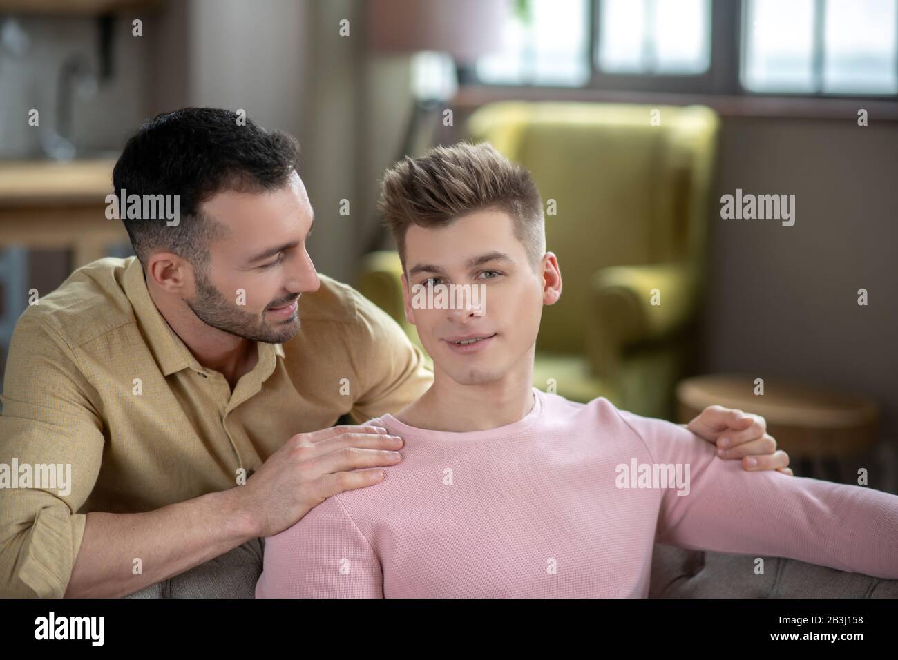 Man shoulder putting hand hi-res stock photography and images - Alamy