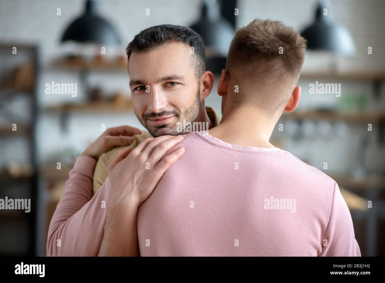 Two men only hugging hi-res stock photography and images - Alamy