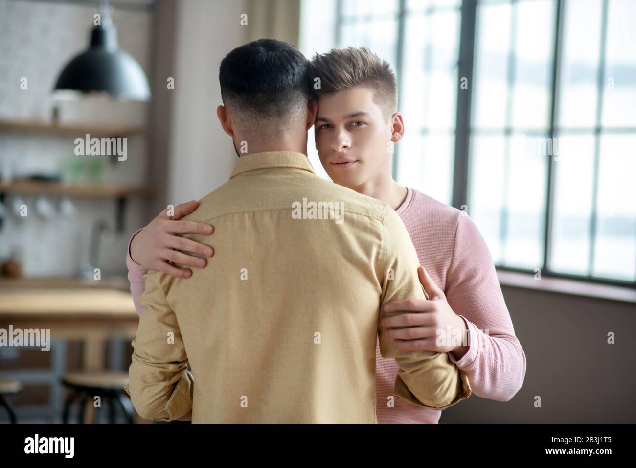 Men hugging each other hi-res stock photography and images - Alamy