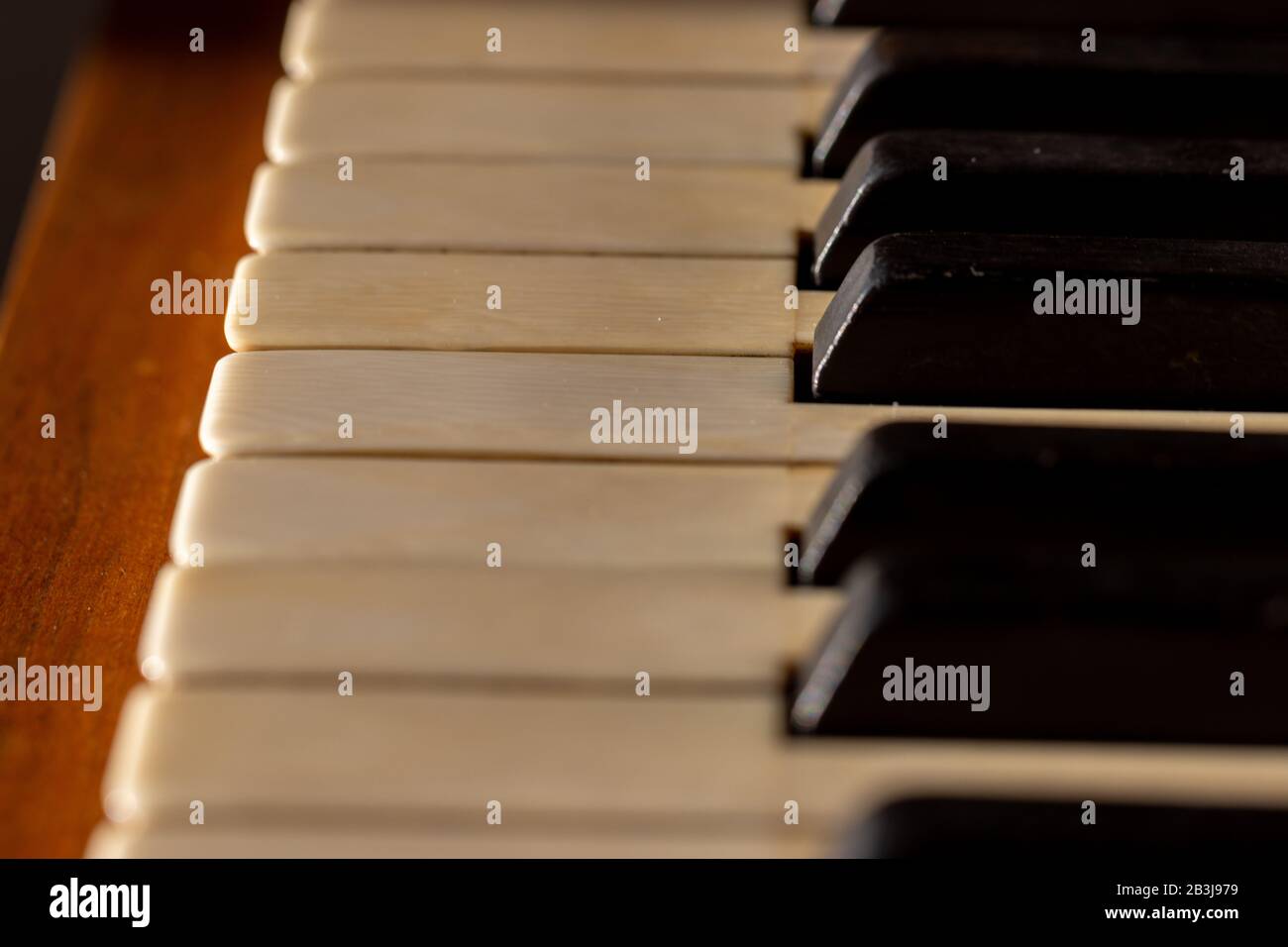 Low angle of ivory piano keyboard in morning sunlight Stock Photo - Alamy