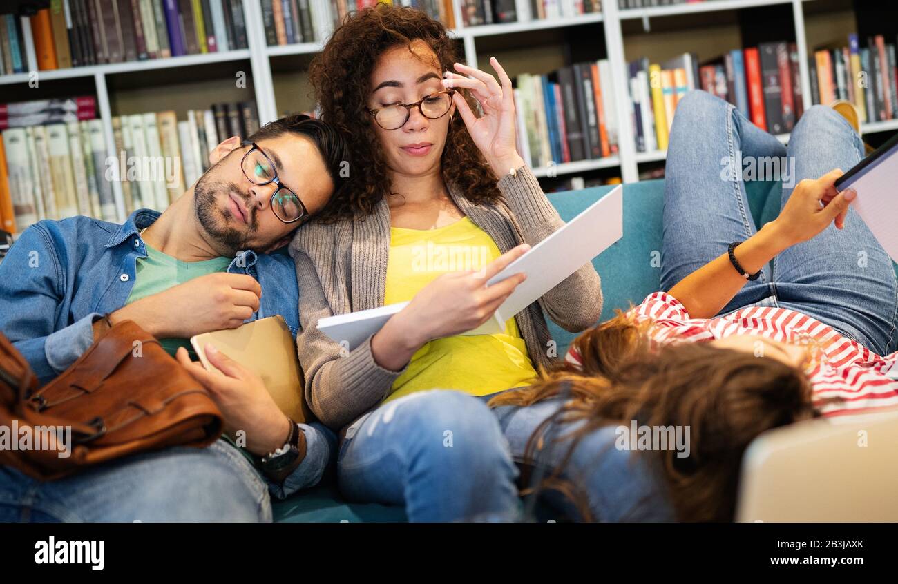 College, study, university and education concept. Group of tired ...