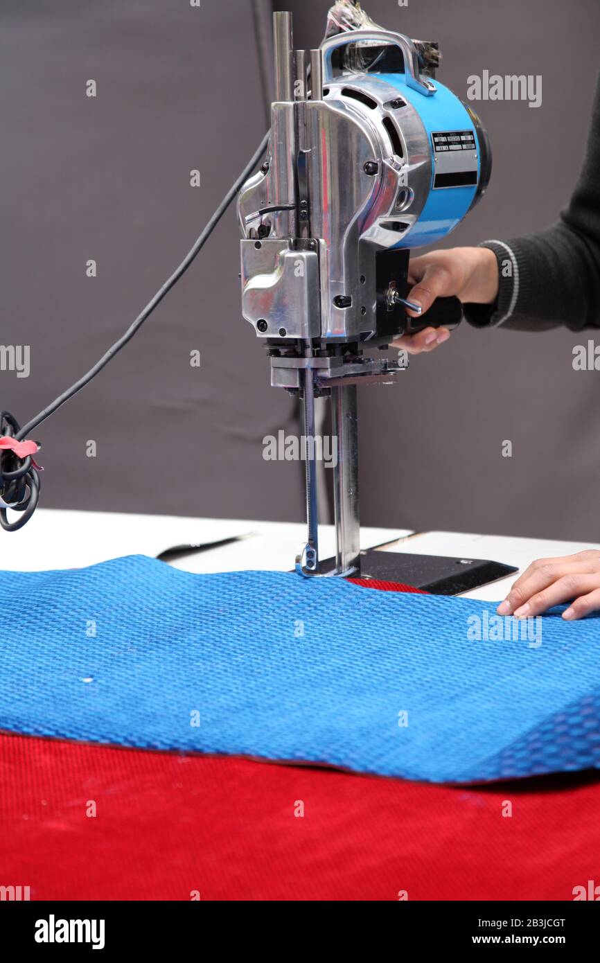 worker working in textile workshop Stock Photo - Alamy
