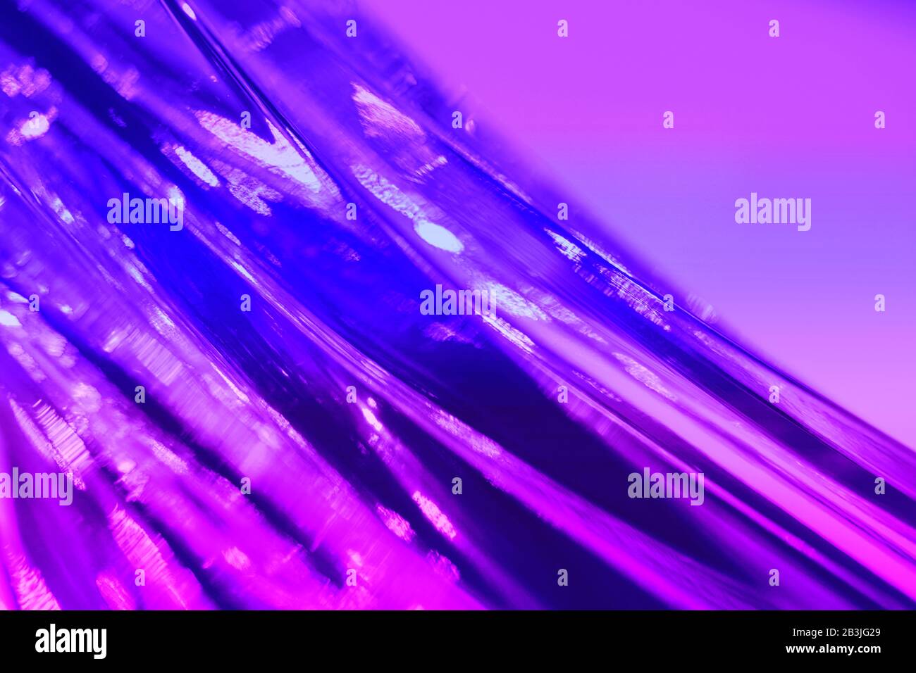 Abstract blurred neon pink and purple wavy background Stock Photo - Alamy