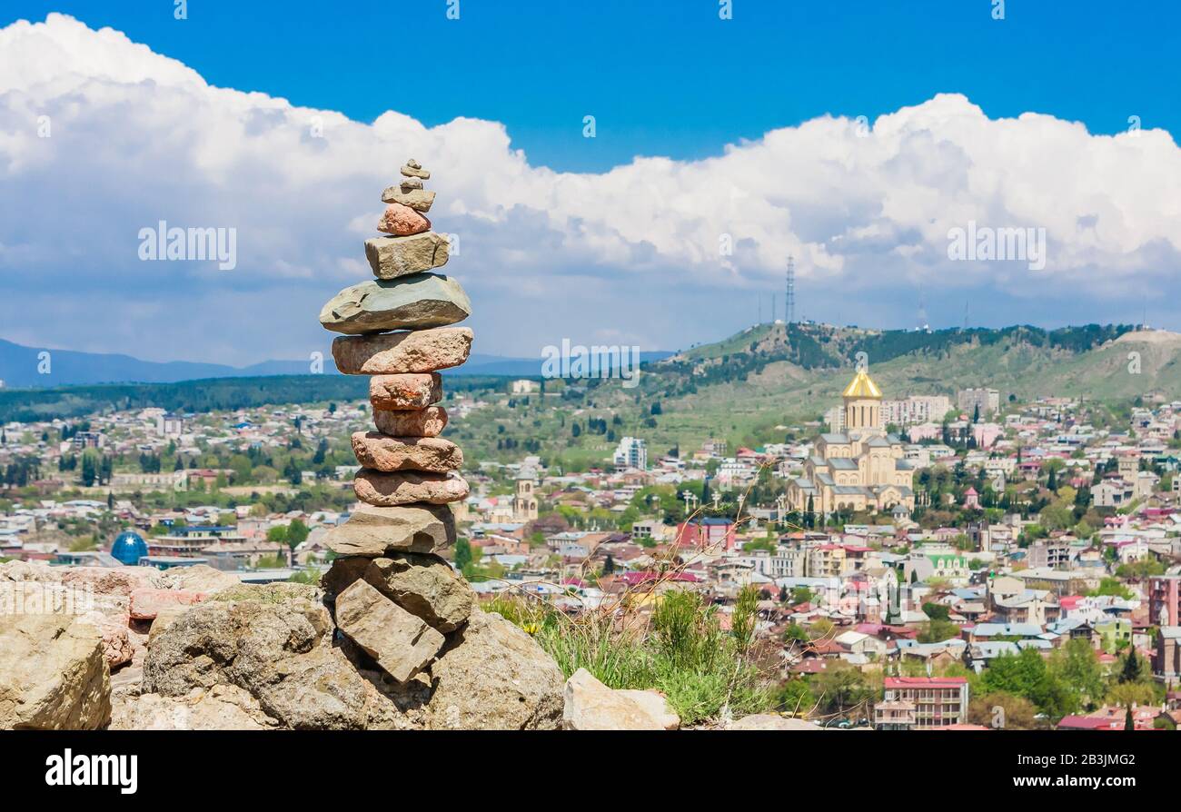 Pyramid of stones and panoramic view of Tbilisi city. Georgia Stock ...