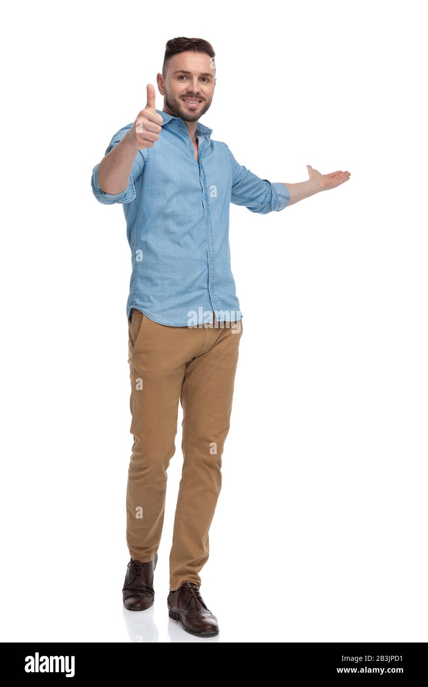 fine gentleman with blue shirt walking and greeting polite with a ok ...