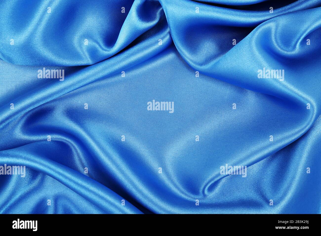 Smooth elegant blue silk or satin luxury cloth texture can use as ...