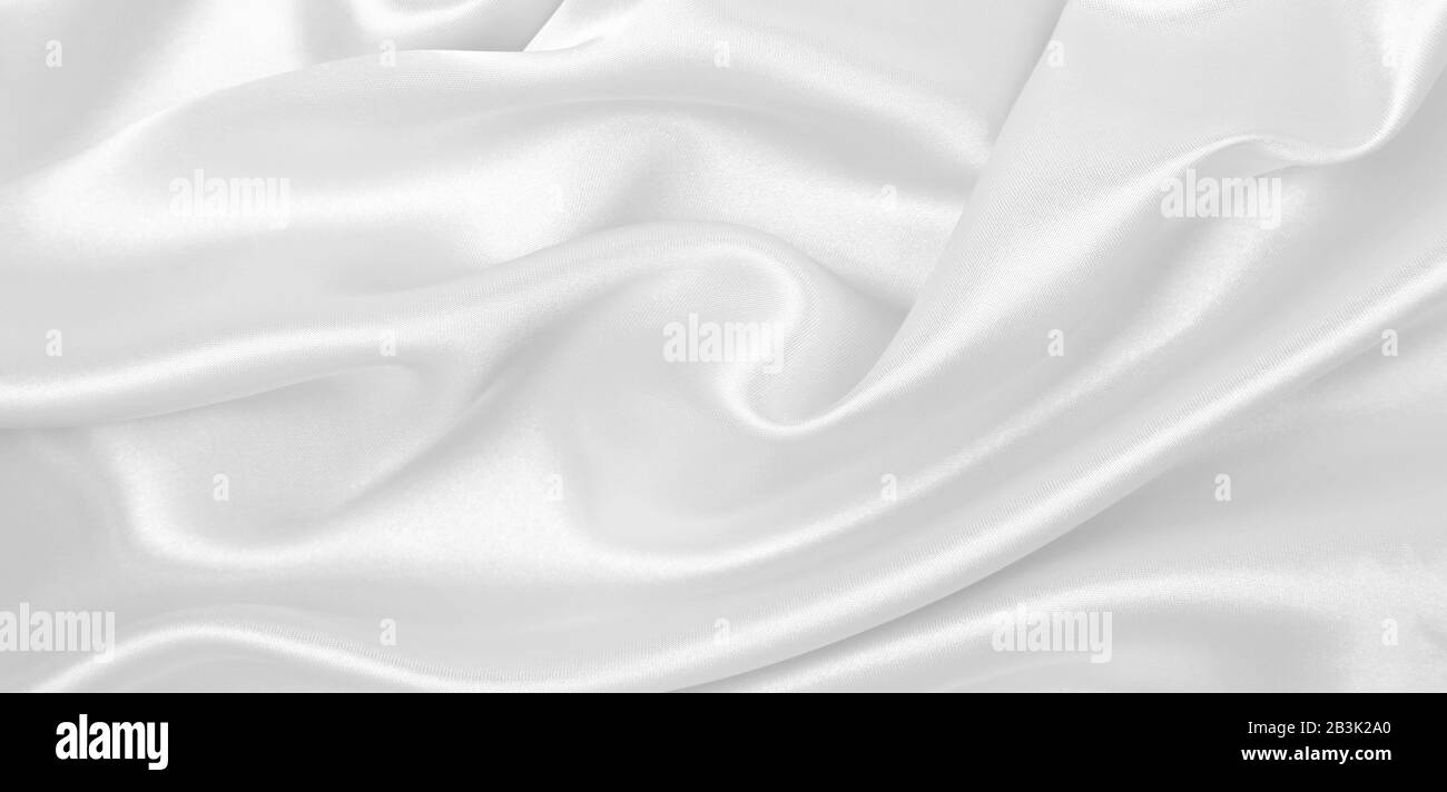 Smooth elegant white silk or satin luxury cloth texture can use as ...