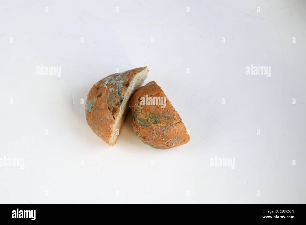 Slices of moldy bread. Rotten and nasty. Located on a white background ...