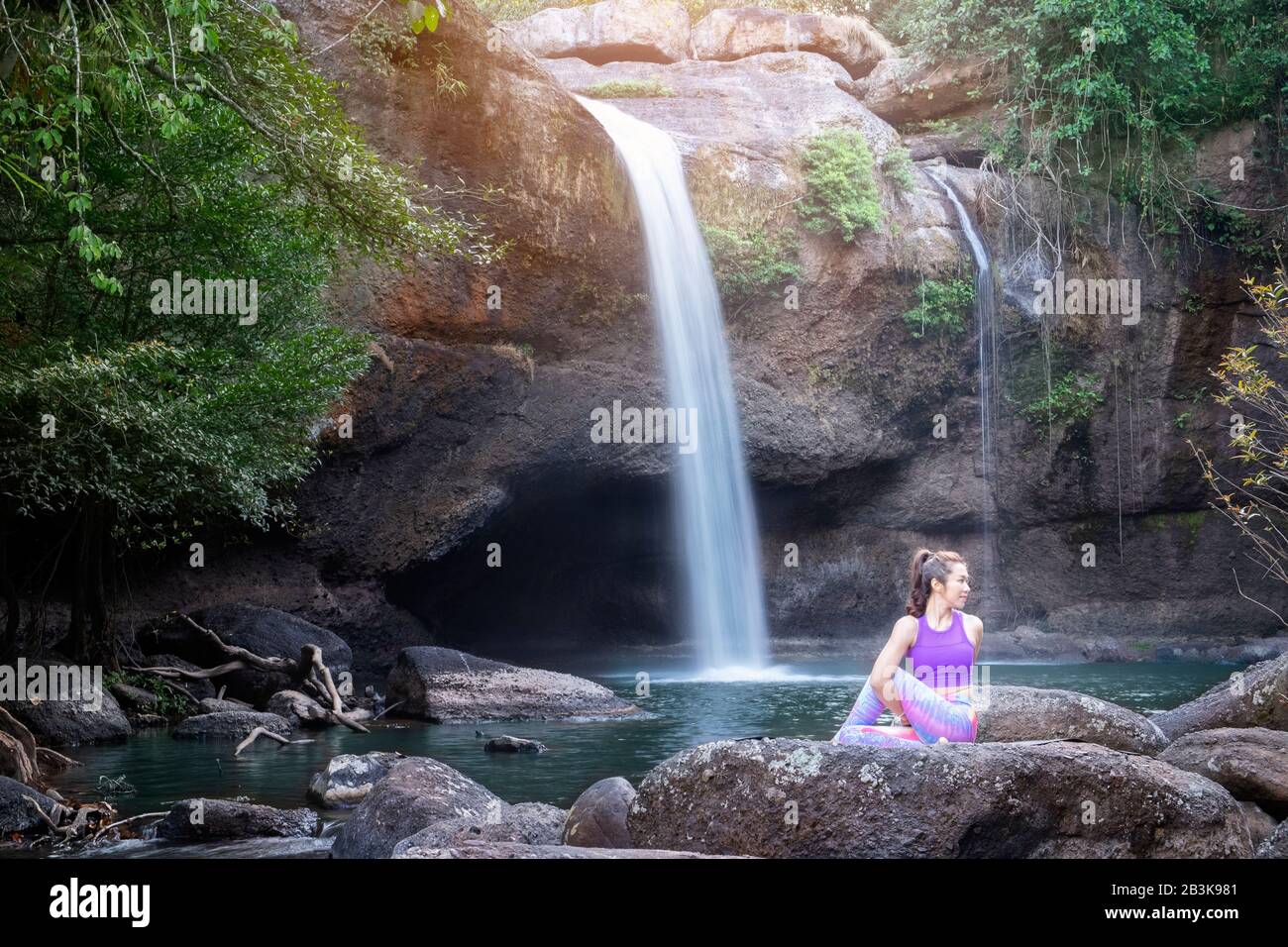 Woman yoga in front waterfall hi-res stock photography and images - Alamy