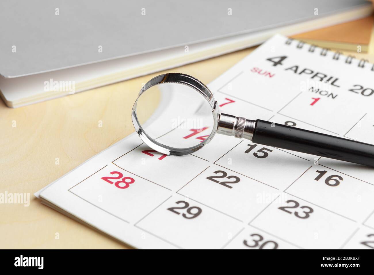 Magnifying glass and calendar,Concept in business and meetings Stock ...