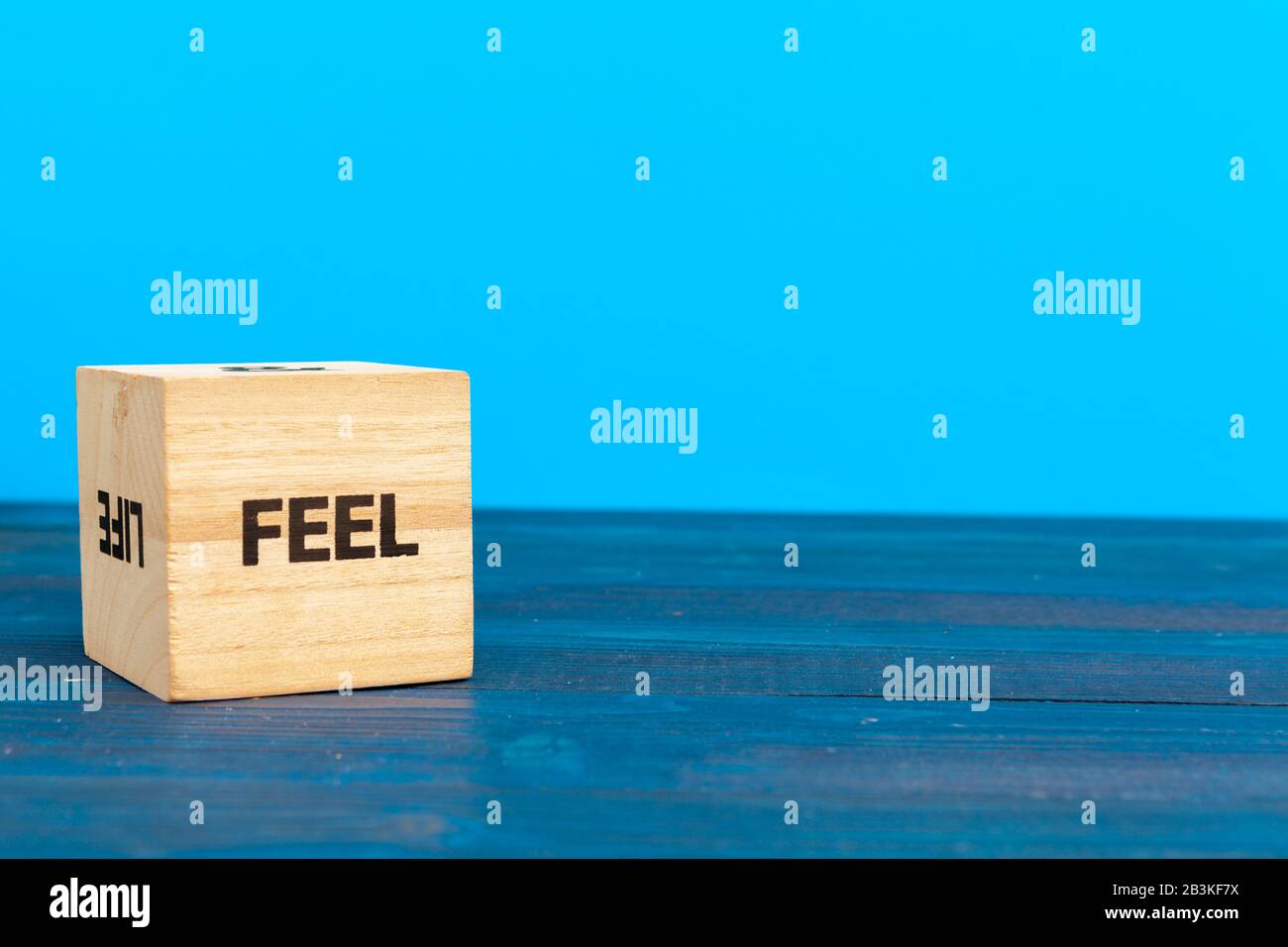 cube wooden block with alphabet building the word feel Stock Photo - Alamy