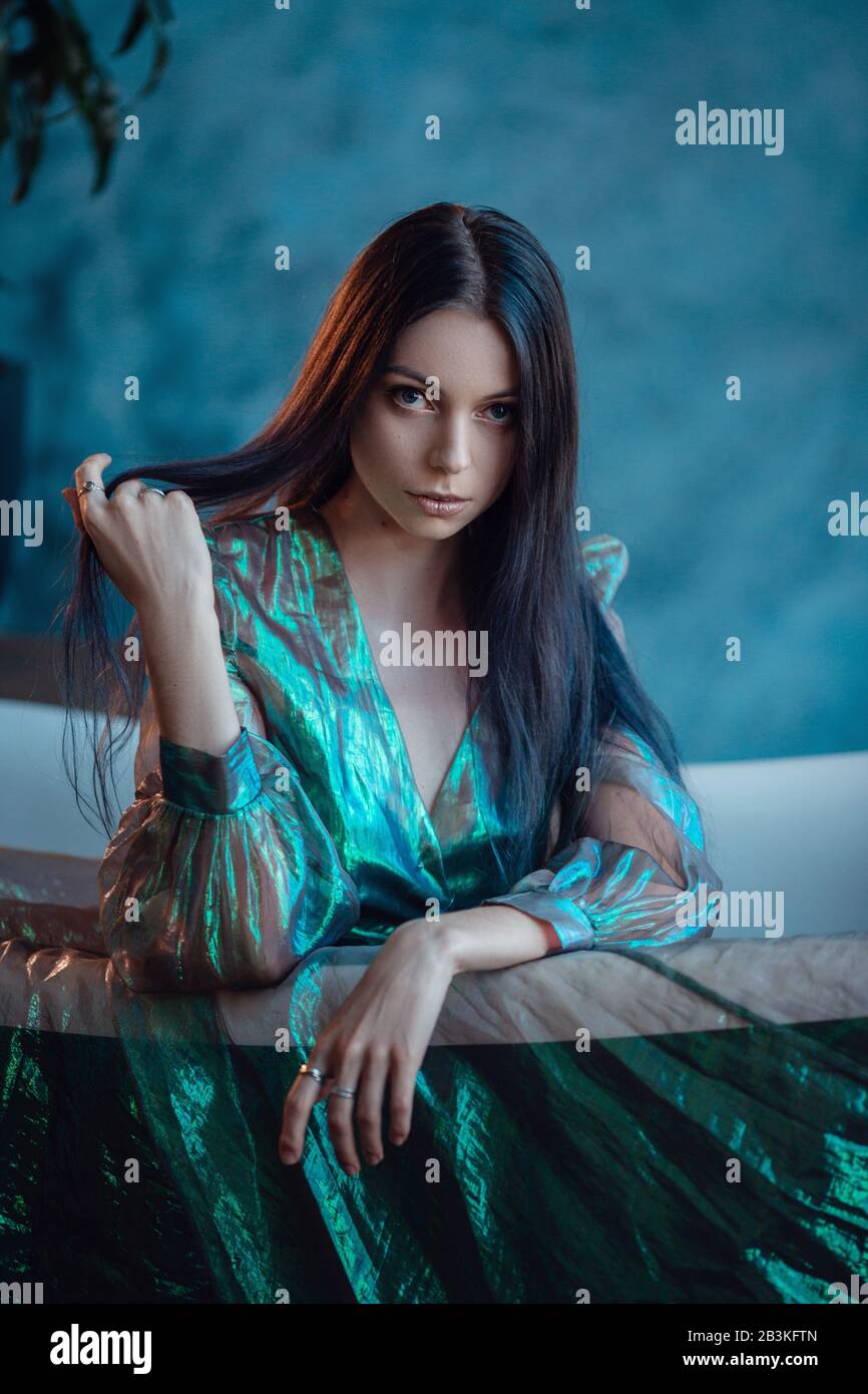 A woman looks like a sad little mermaid from a fairy tale. Beautiful ...