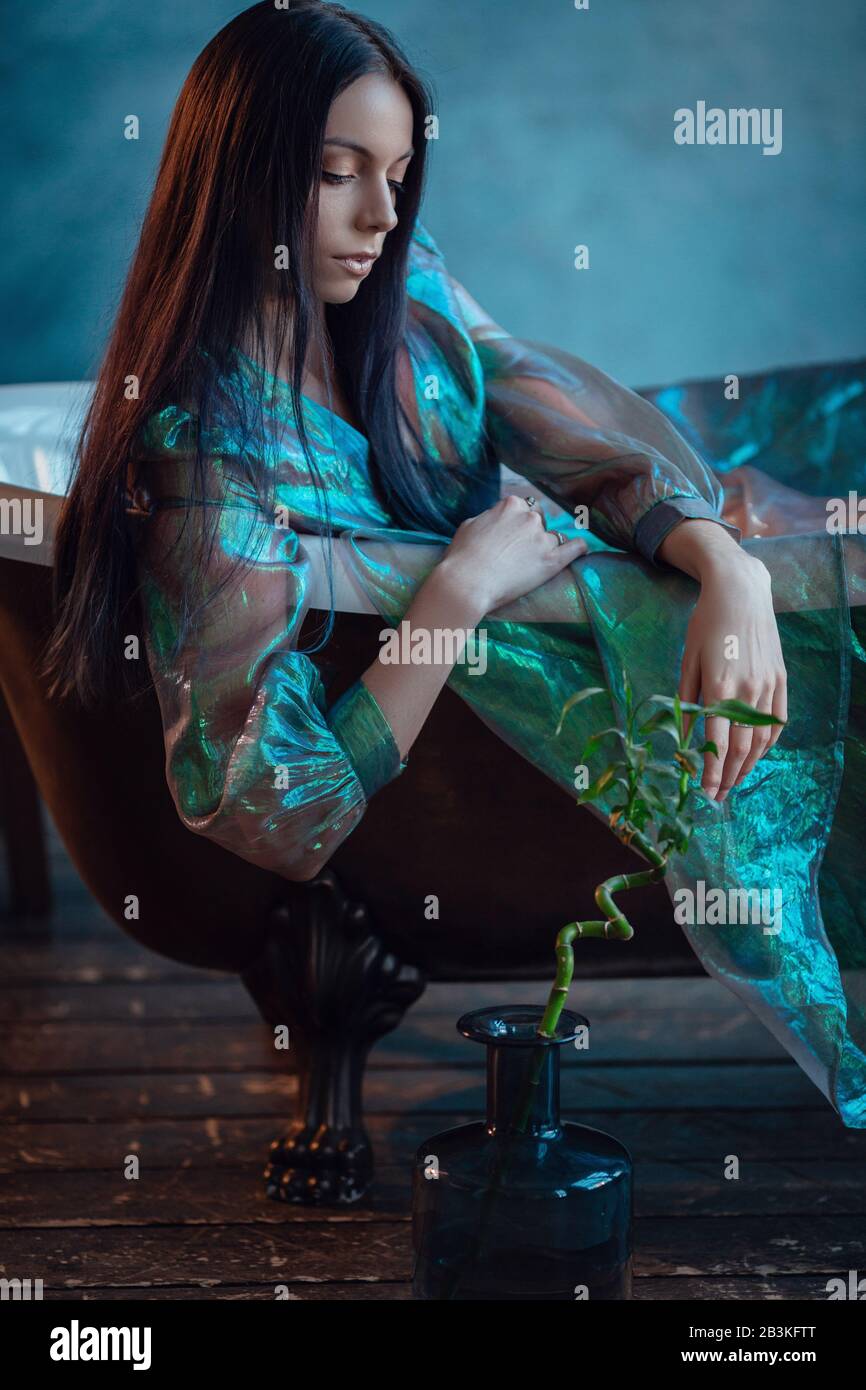 A woman looks like a sad little mermaid from a fairy tale. Beautiful ...