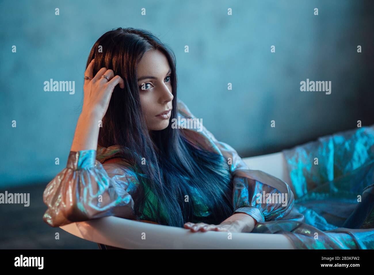 A woman looks like a sad little mermaid from a fairy tale. Beautiful ...