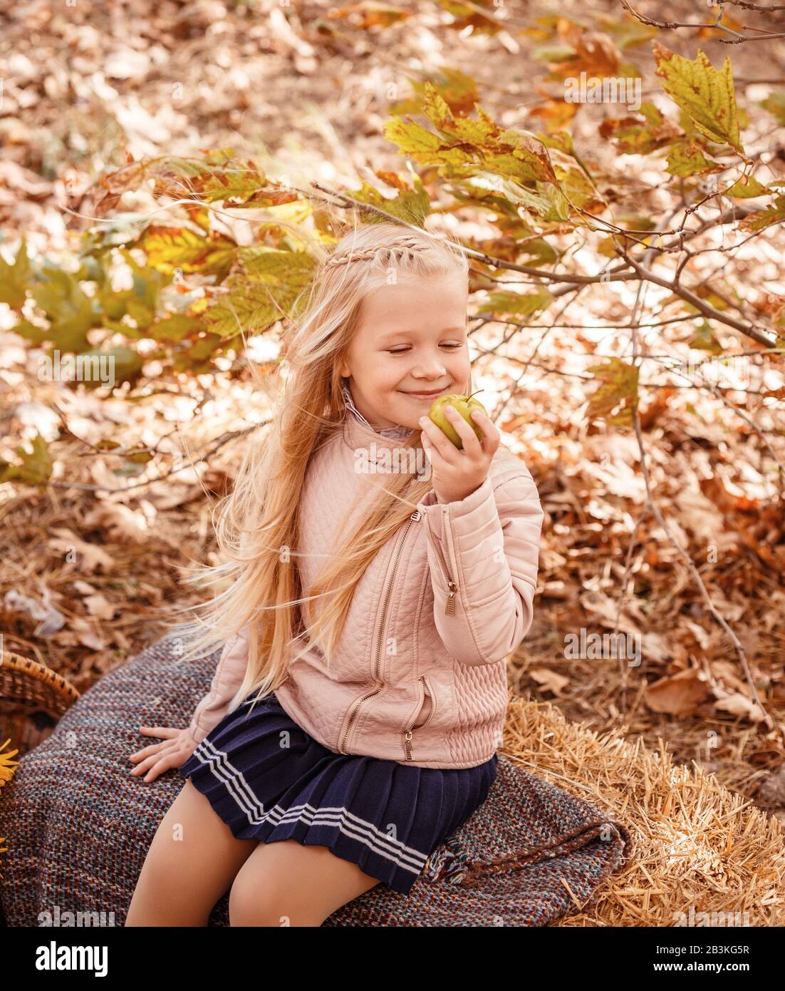 Happy cute girl in autumn fall outdoor. Celebrate harvest festival. Kid ...