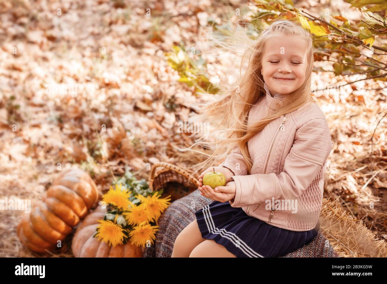 Happy cute girl in autumn fall outdoor. Celebrate harvest festival. Kid ...