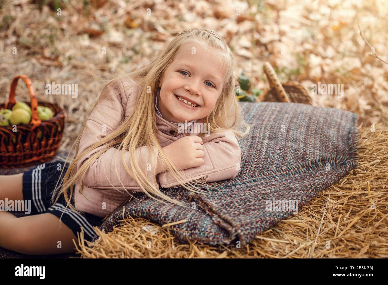 Happy cute girl in autumn fall outdoor. Celebrate harvest festival. Kid ...