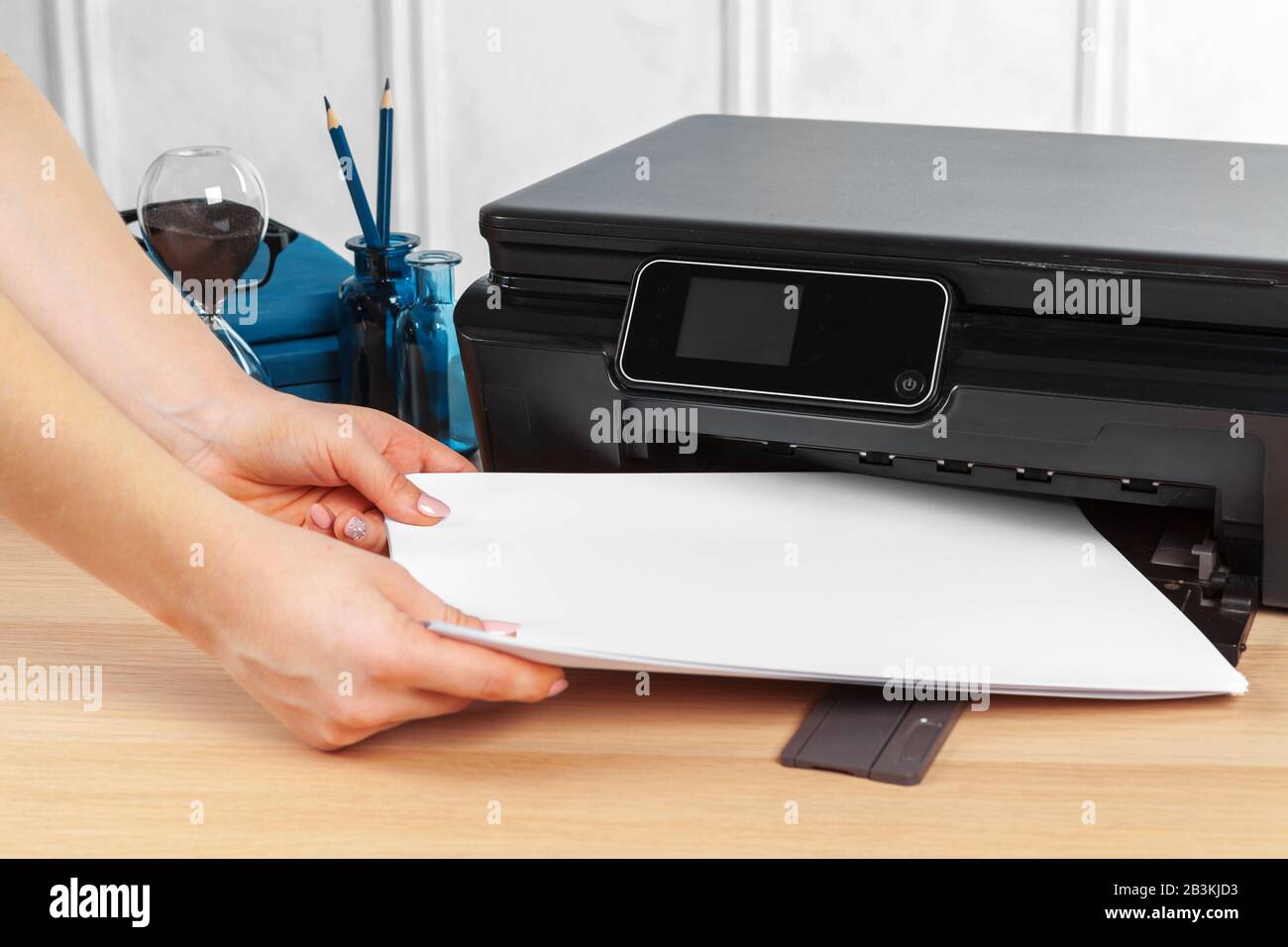 Female secretary making photocopies on xerox machine in office Stock ...