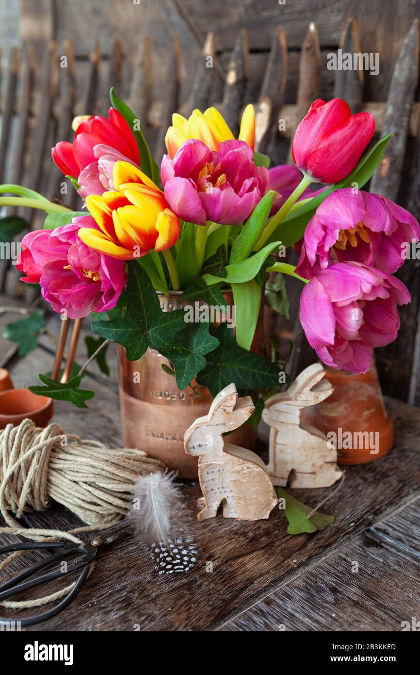 Colorful bunch of flowers with fresh tulips and ivy Stock Photo - Alamy