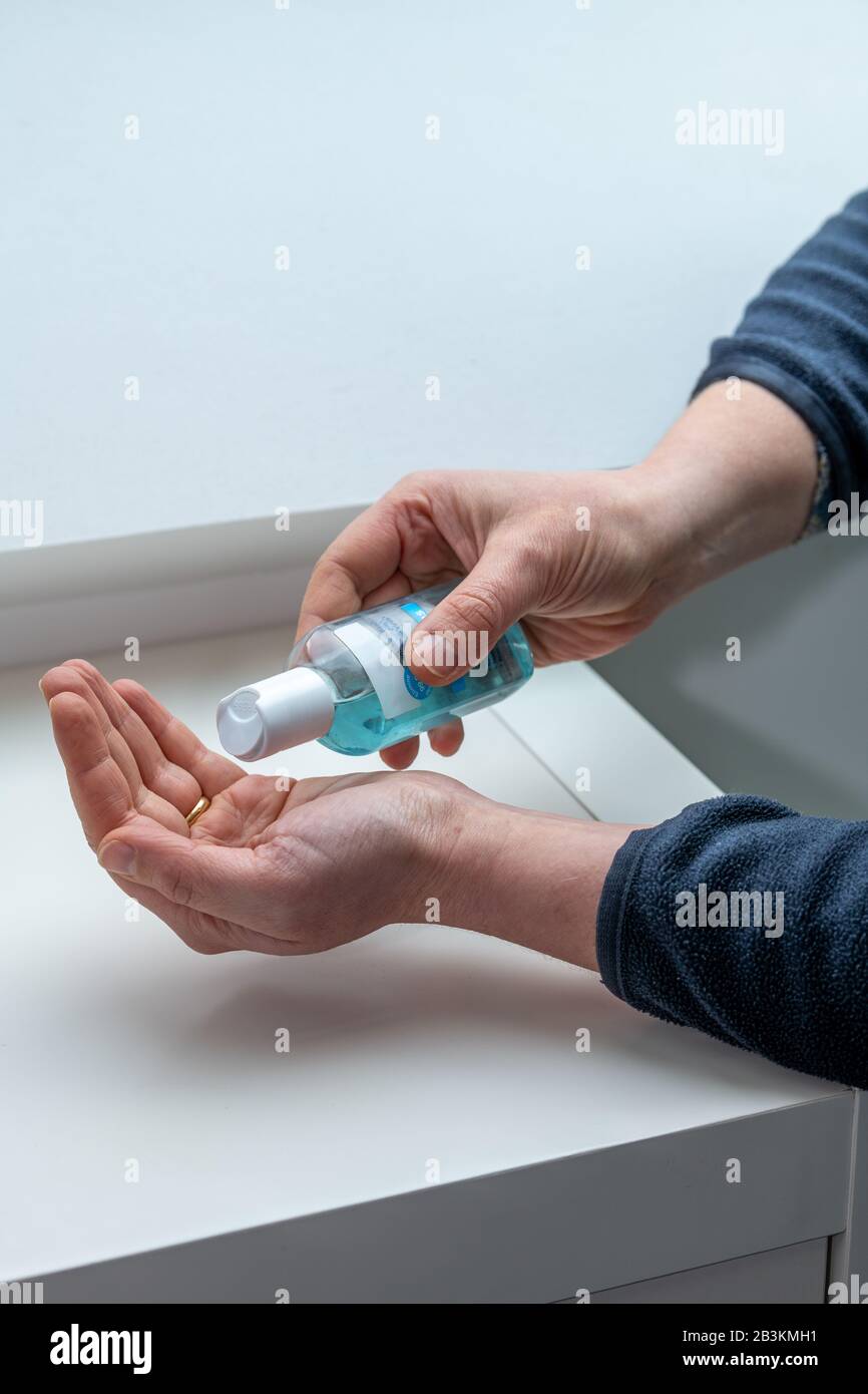 Woman using hydroalcoholic gel hi-res stock photography and images - Alamy