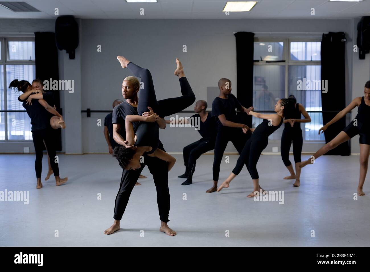 Group of modern dancers practicing a dance routine in a studio Stock ...