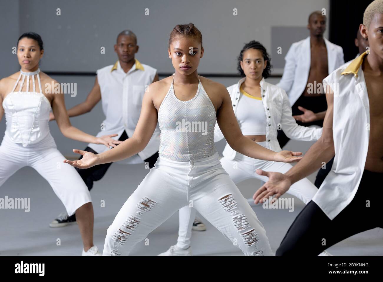 Mixed race modern dancers practicing a dance routine in a studio Stock ...