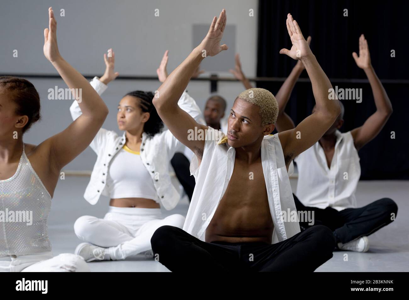 Mixed race modern dancers practicing a dance routine in a studio Stock ...