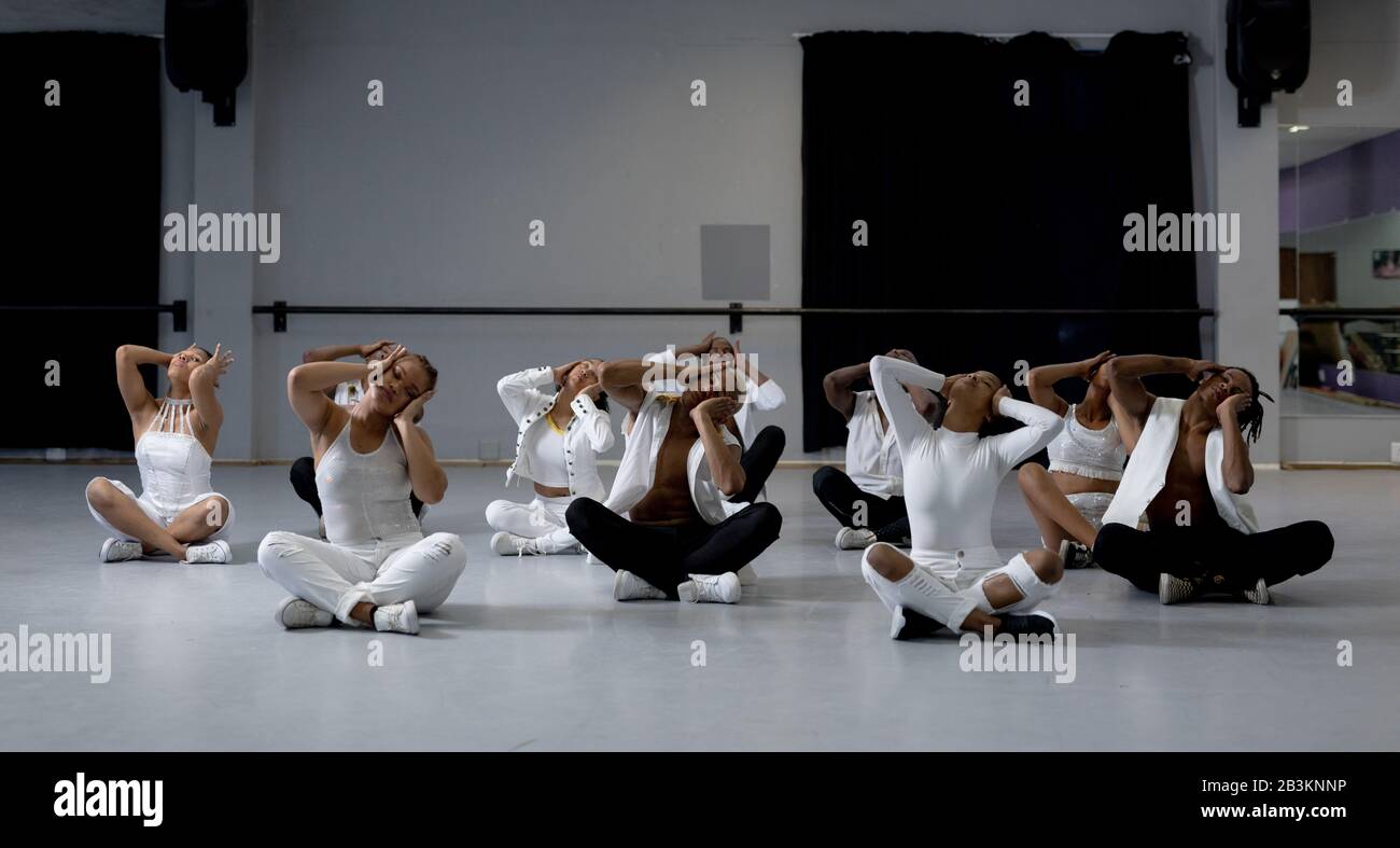 Mixed race modern dancers practicing a dance routine in a studio Stock ...