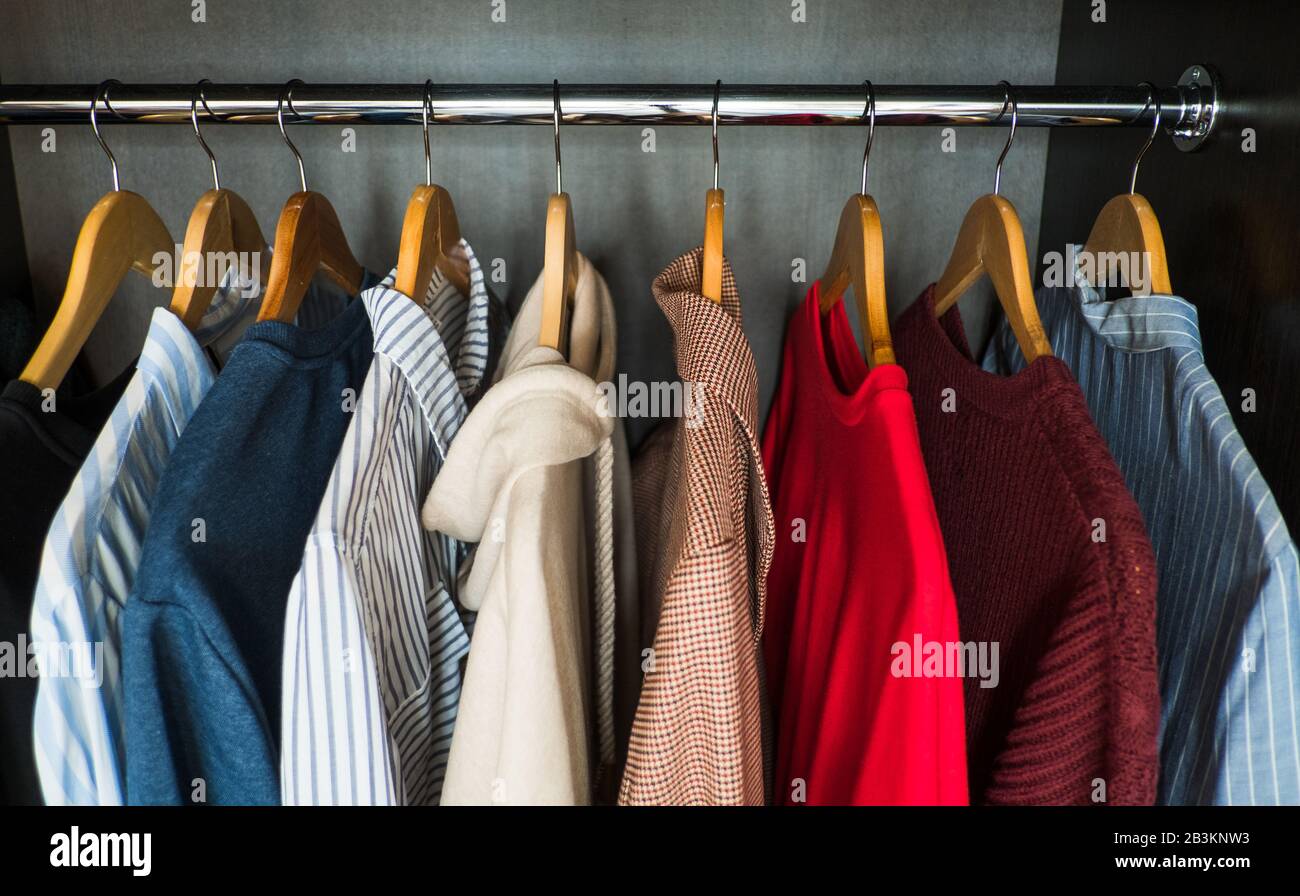 Different clothes on hangers hi-res stock photography and images - Alamy
