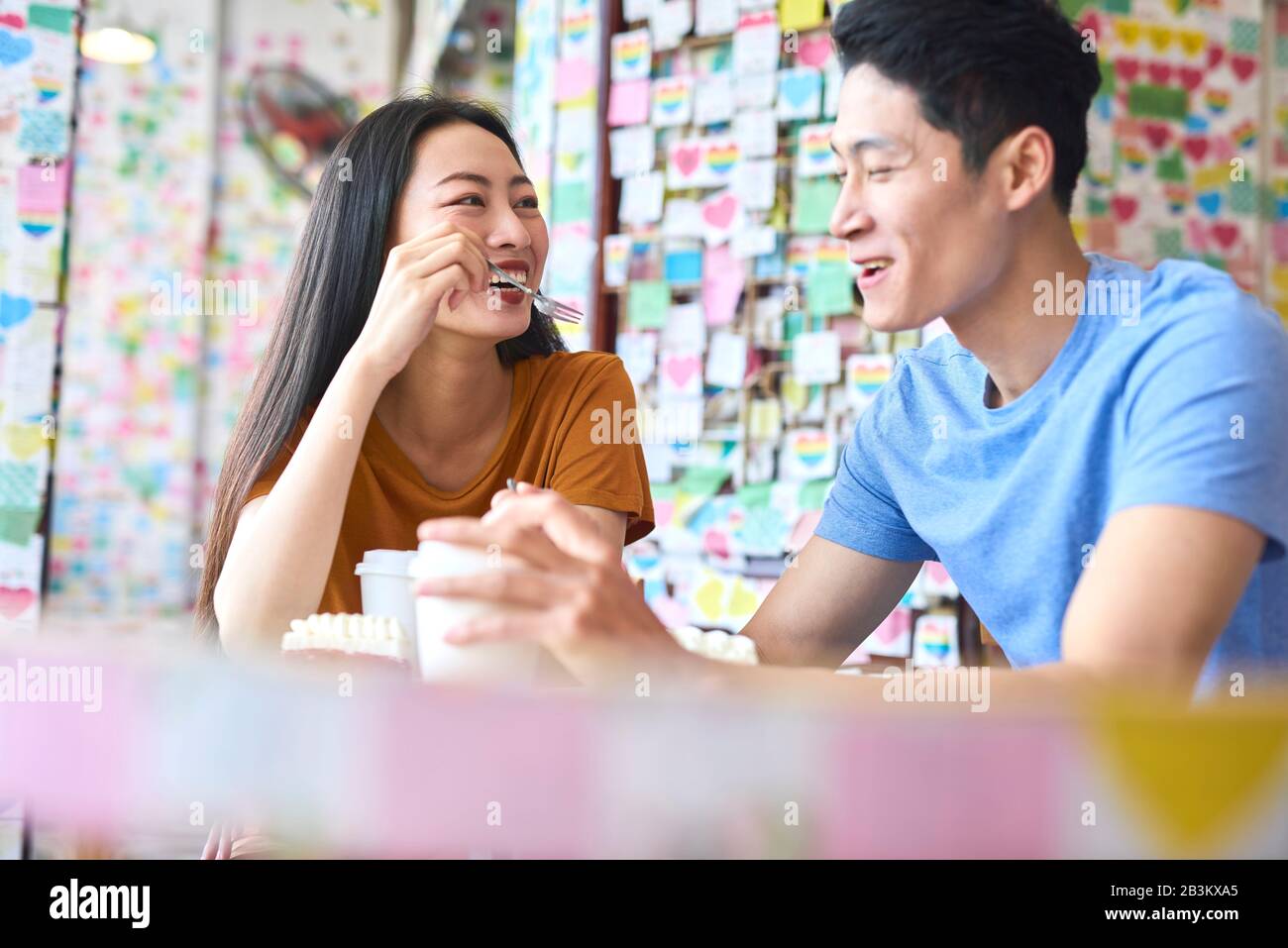 Young couple have interesting discussion in a cafe Stock Photo - Alamy