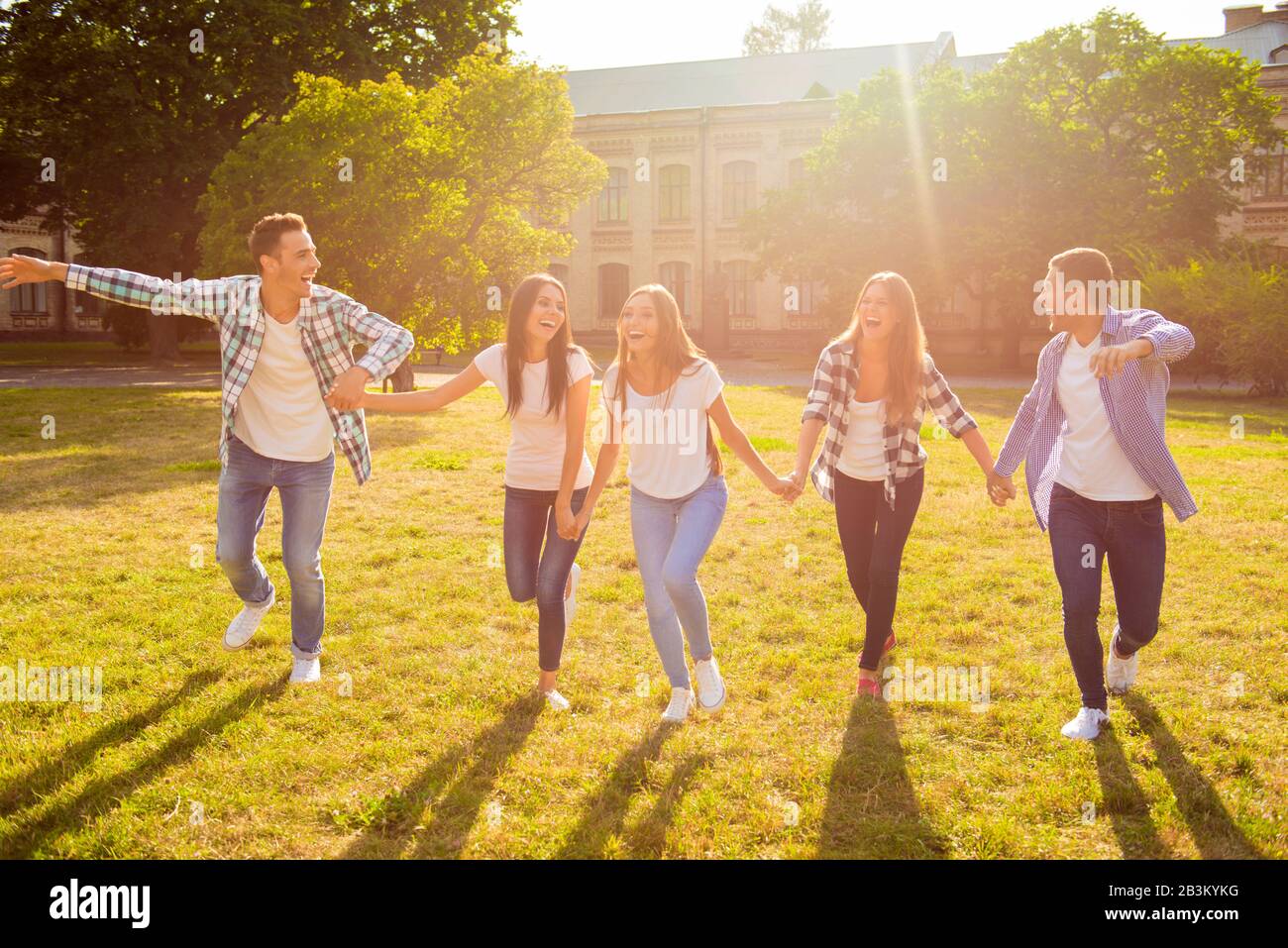 Teenagers male and female run hands hi-res stock photography and images ...