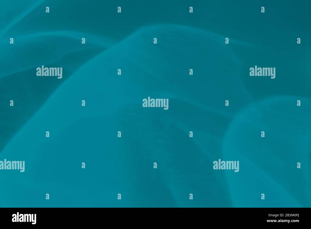 Blue colored abstract background with light and shadows caustic effect ...