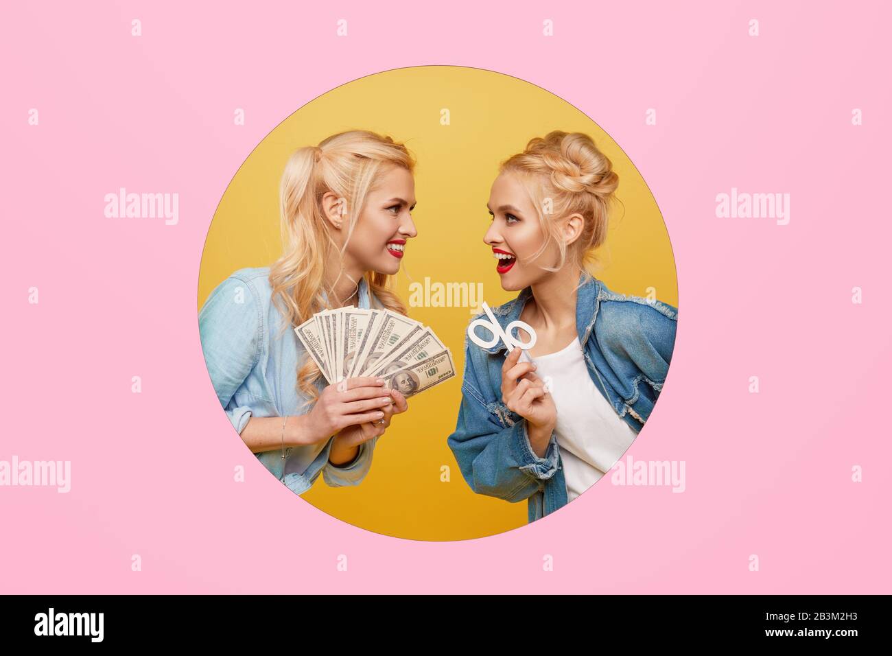 Two young shocked women with a bundle of banknotes money, text Sale and ...