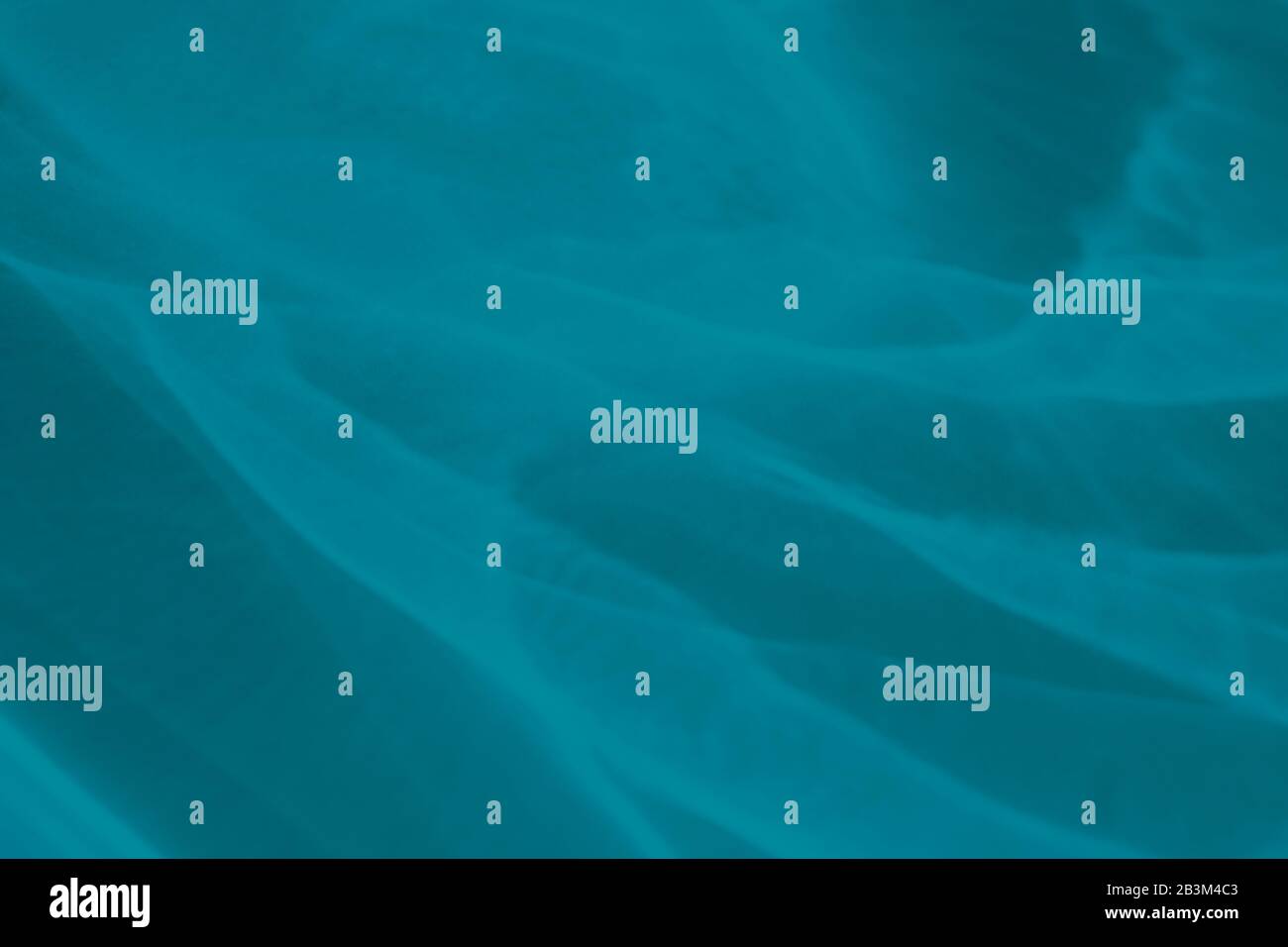 Blue colored abstract background with light and shadows caustic effect ...