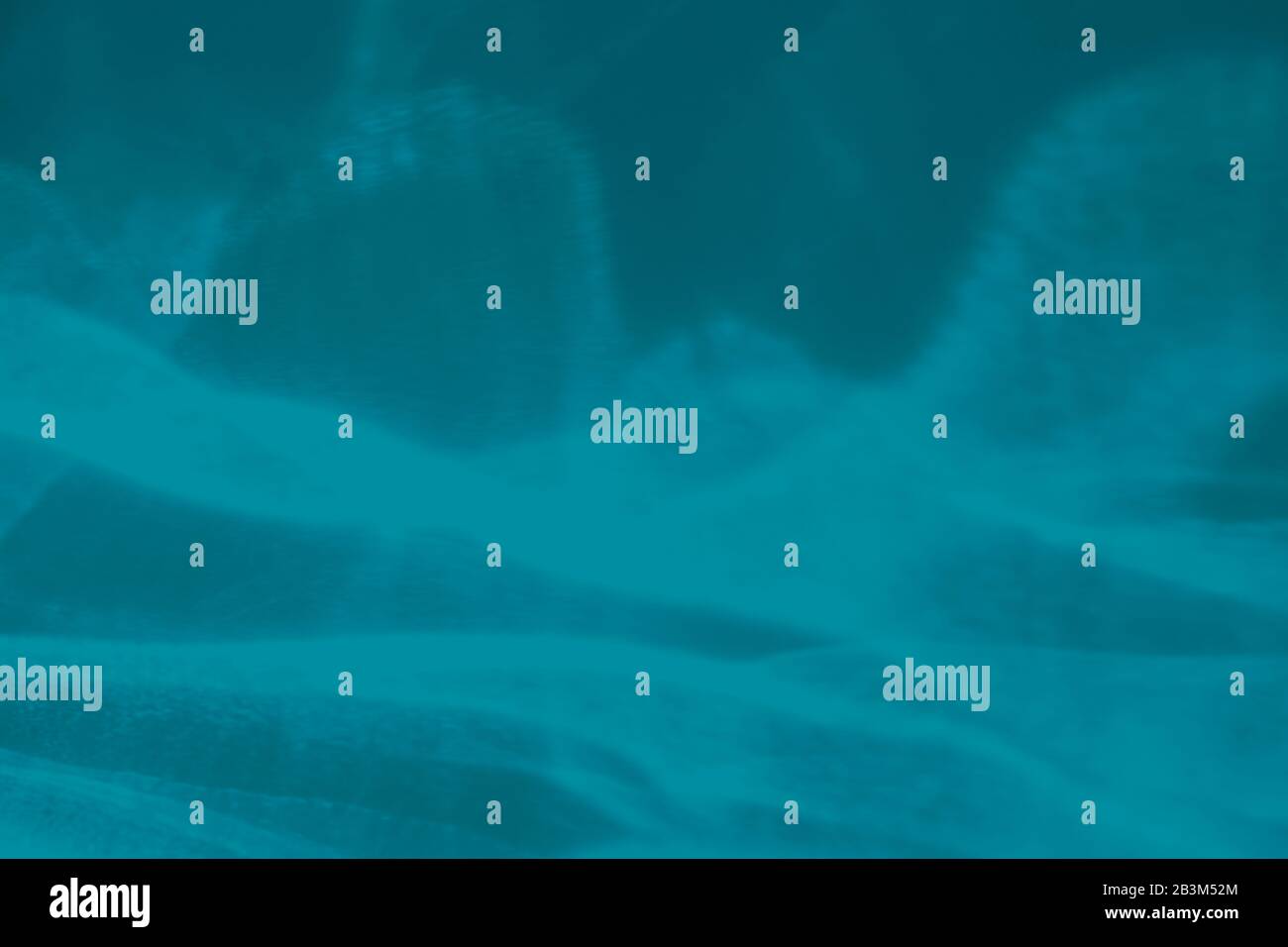 Blue colored abstract background with light and shadows caustic effect ...