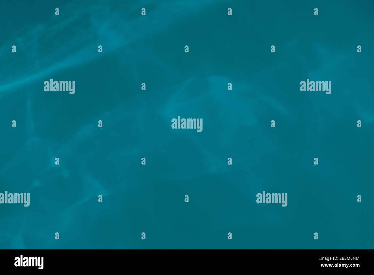 Blue colored abstract background with light and shadows caustic effect ...