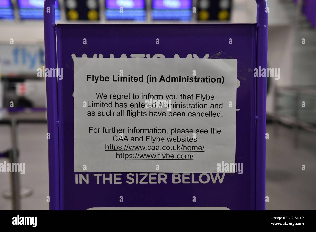 A notice by the empty Flybe check-in desks at Birmingham International ...