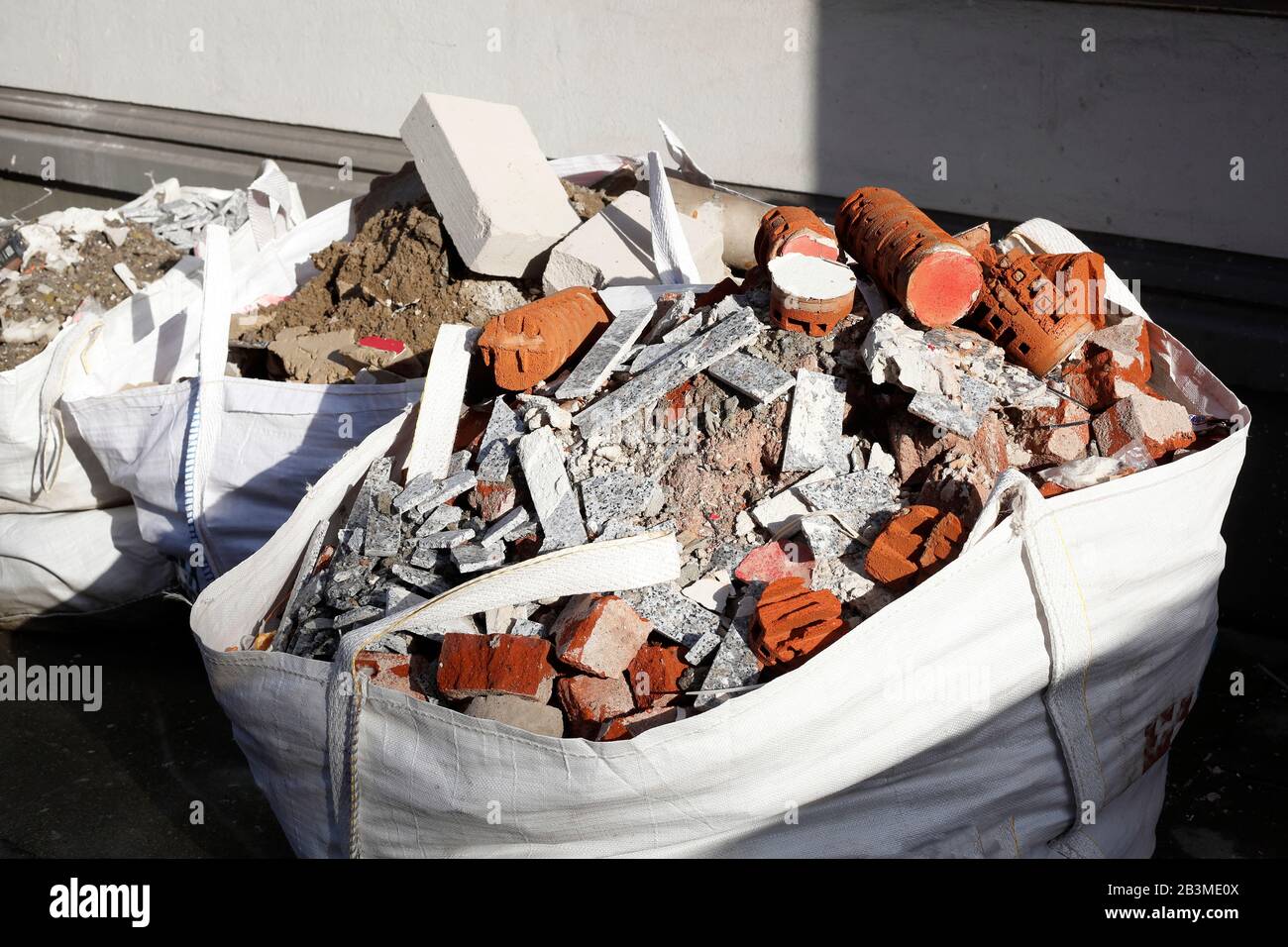Building rubble in a garbage bag, Germany, Europe Stock Photo - Alamy