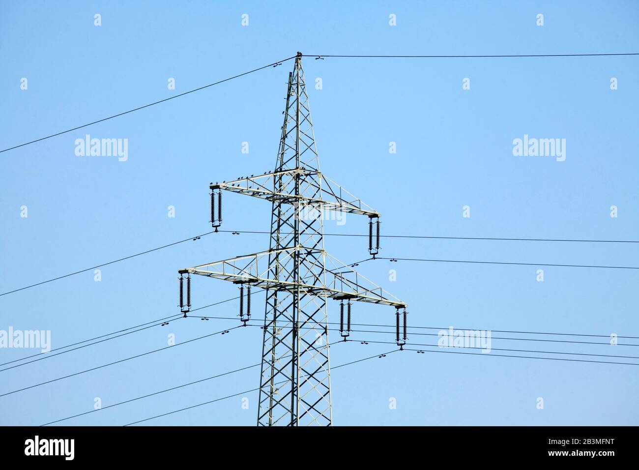 Electricity pylon, blue sky, Germany, Europe Stock Photo - Alamy