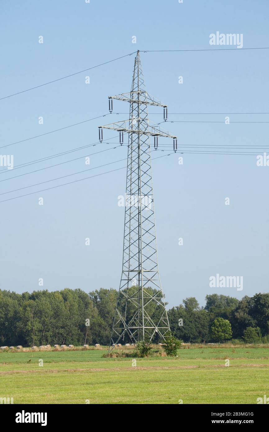 Electricity pylon, blue sky, Germany, Europe Stock Photo - Alamy