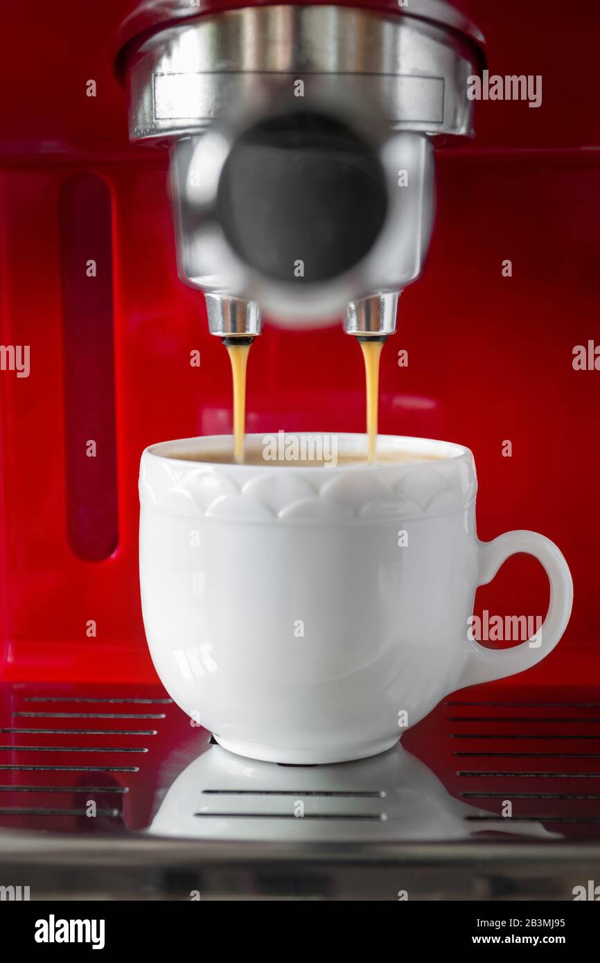 Pouring simple espresso with coffee machine. Closeup, selective focus ...