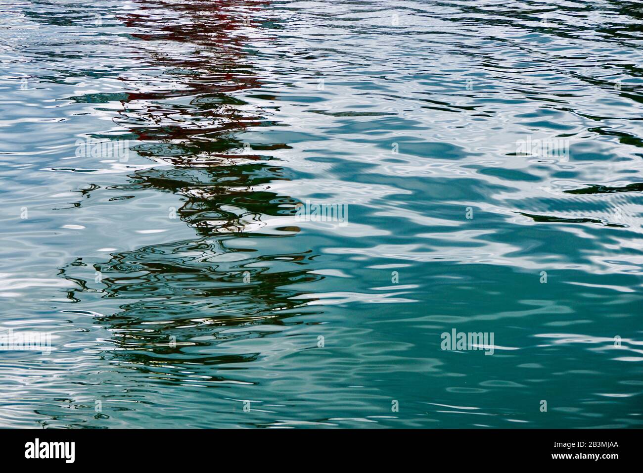 reflection on the blue water Stock Photo - Alamy