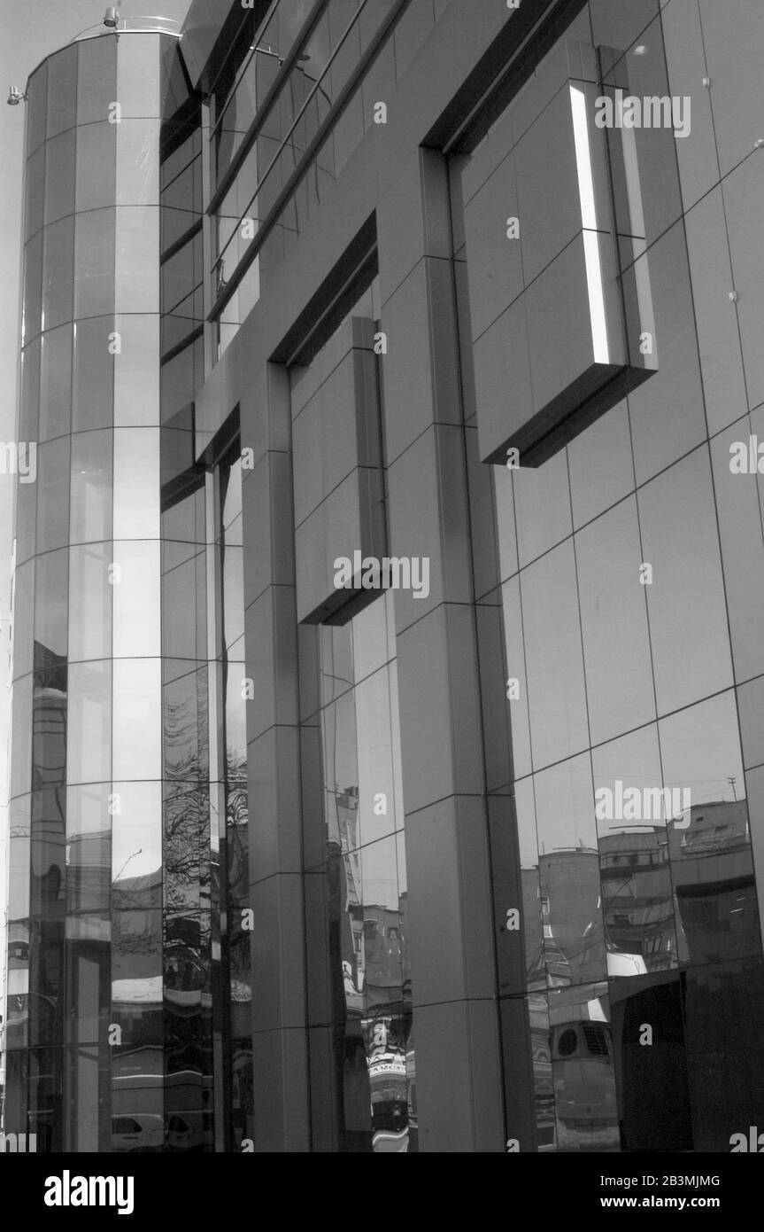 This is a modern office building.The building is fronted with mirror ...