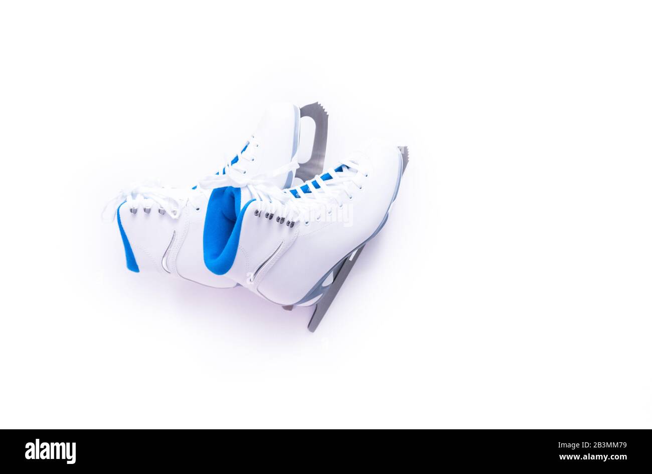 Flat lay. New white figure skates on a white background Stock Photo - Alamy
